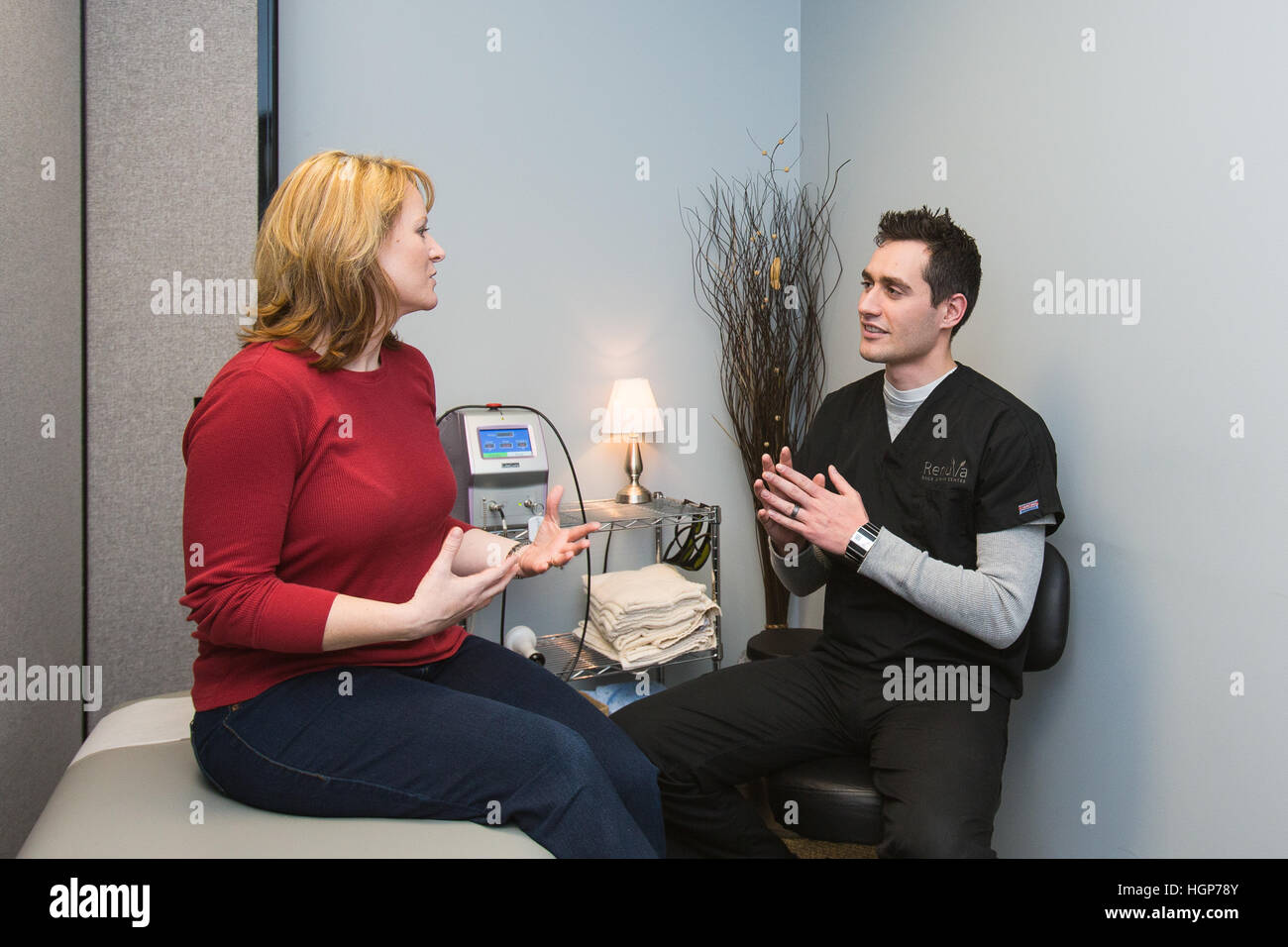 Patient technician interaction in doctor's office Stock Photo - Alamy
