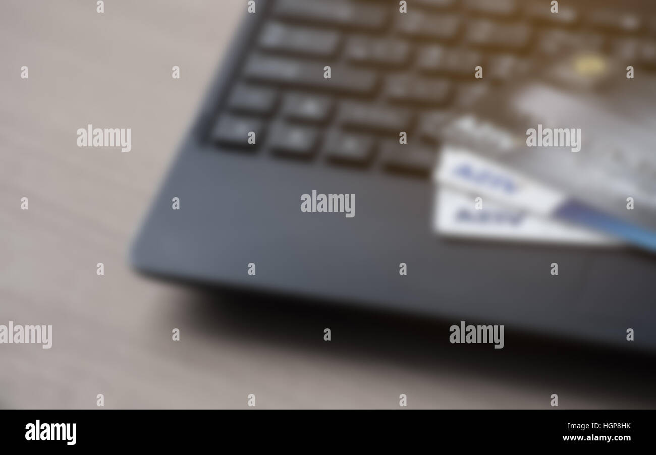 blurry credit card and laptop background Stock Photo - Alamy