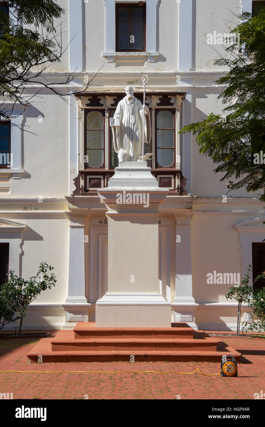 White monument of figure in the outdoor brick courtyard at the ...