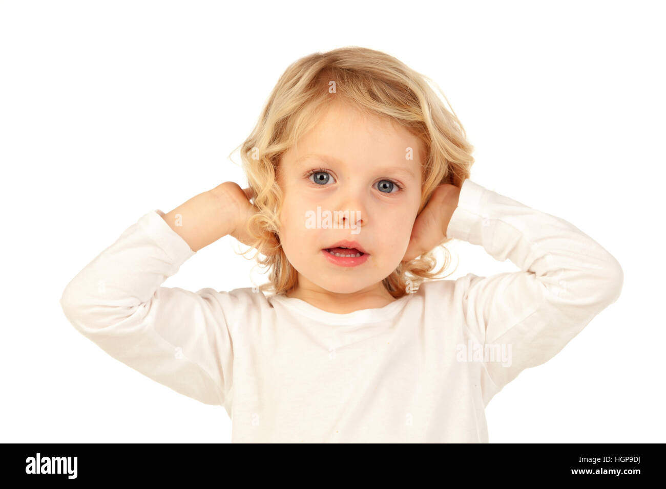 Little kid covering the ears isolated on a white background Stock Photo ...