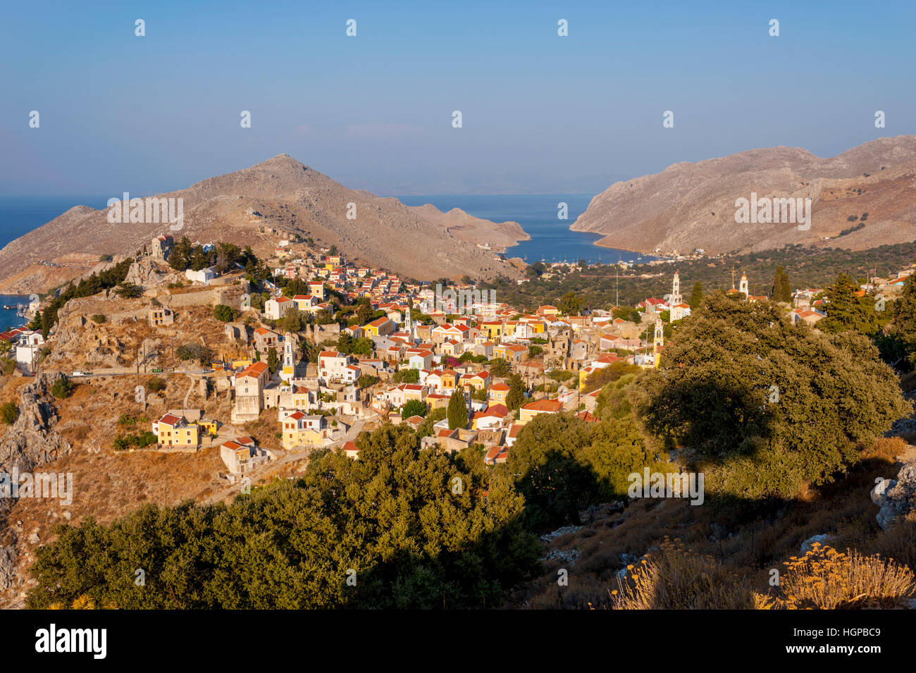 Looking down over Horio to the harbour of Yialos and Pedi bay on the ...