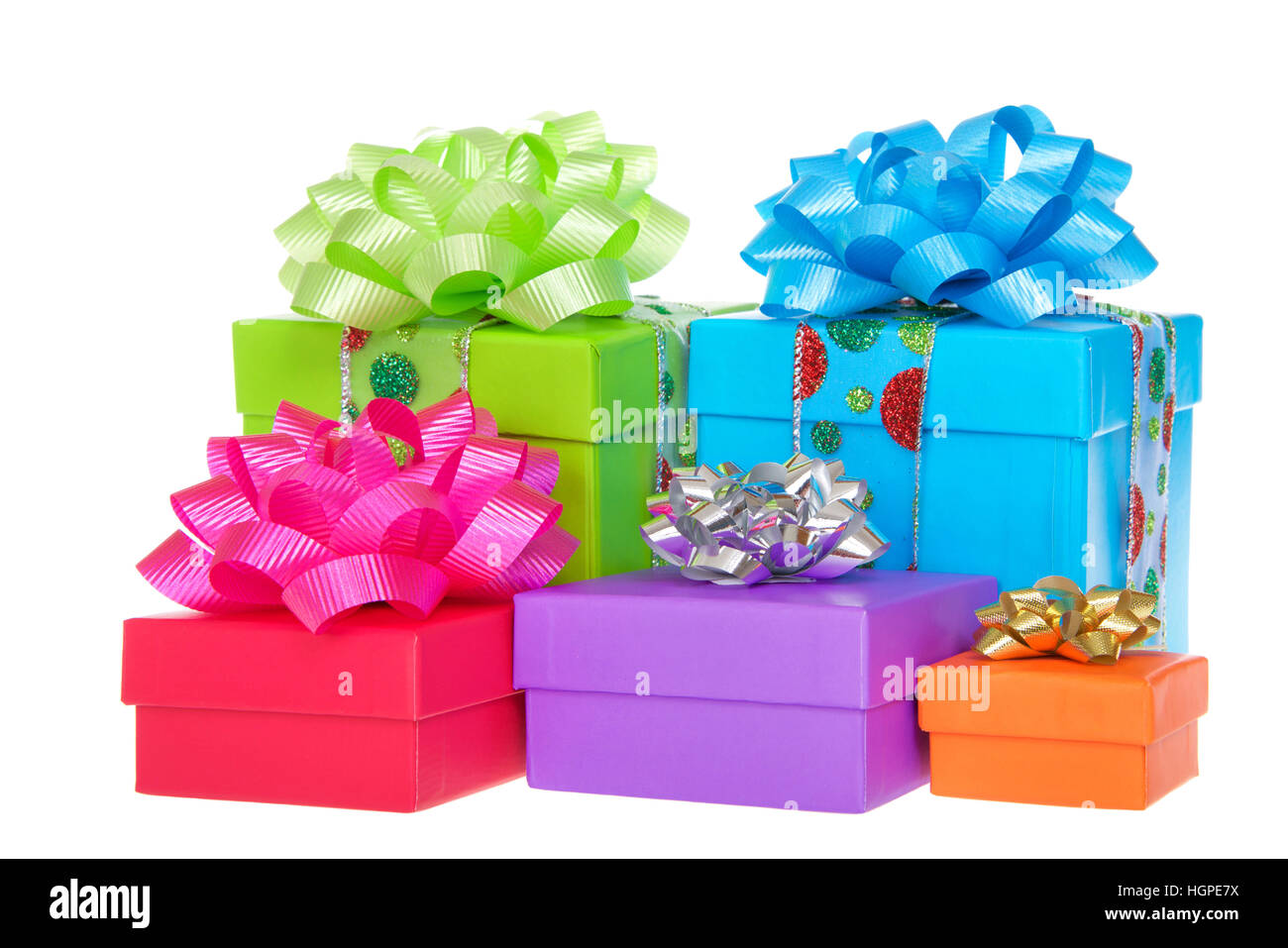 Many brightly colored boxes presents with colorful bows. Holiday ...