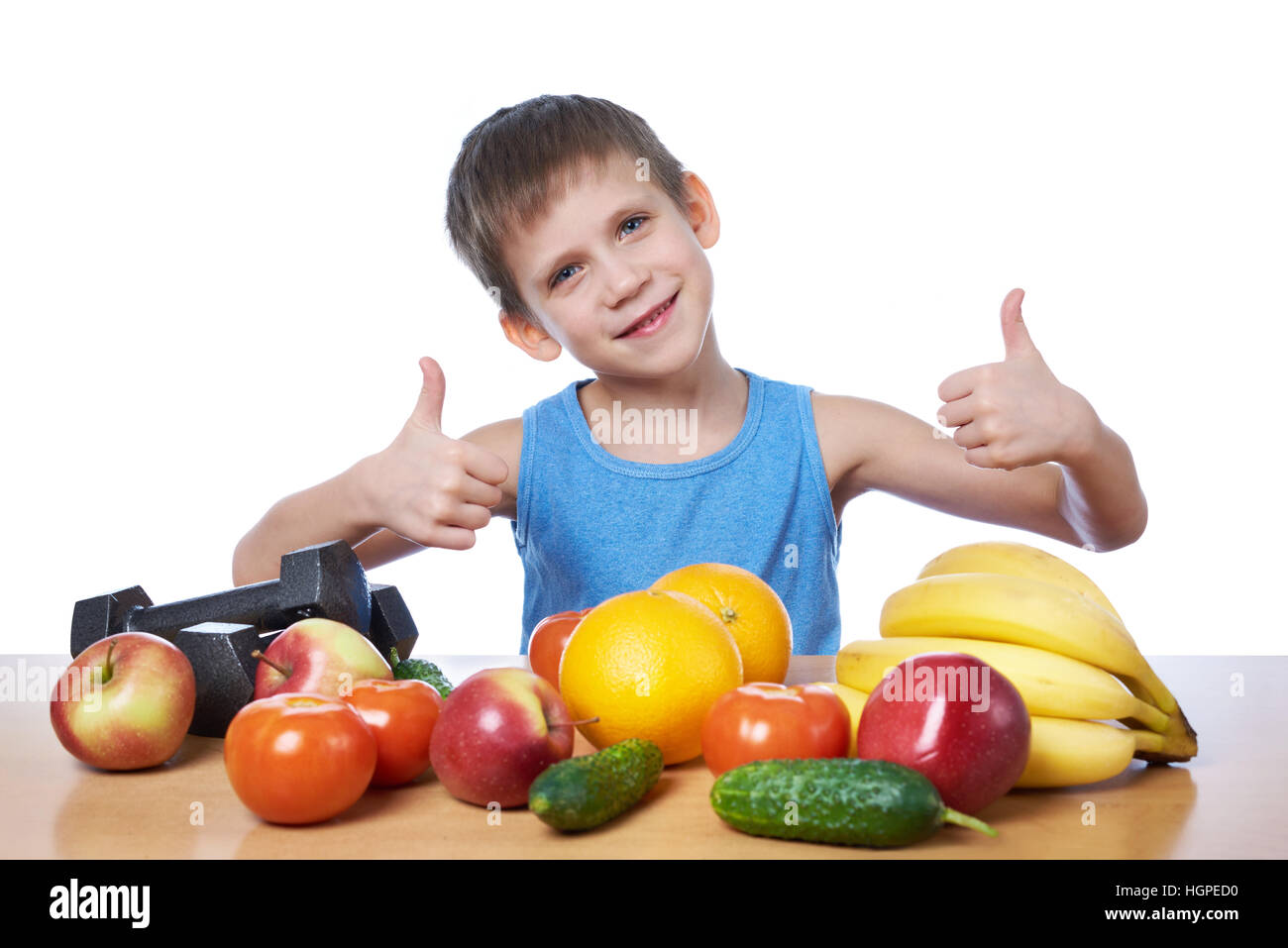Happy healthy boy with fruits, vegetables and dumbbells isolated white ...
