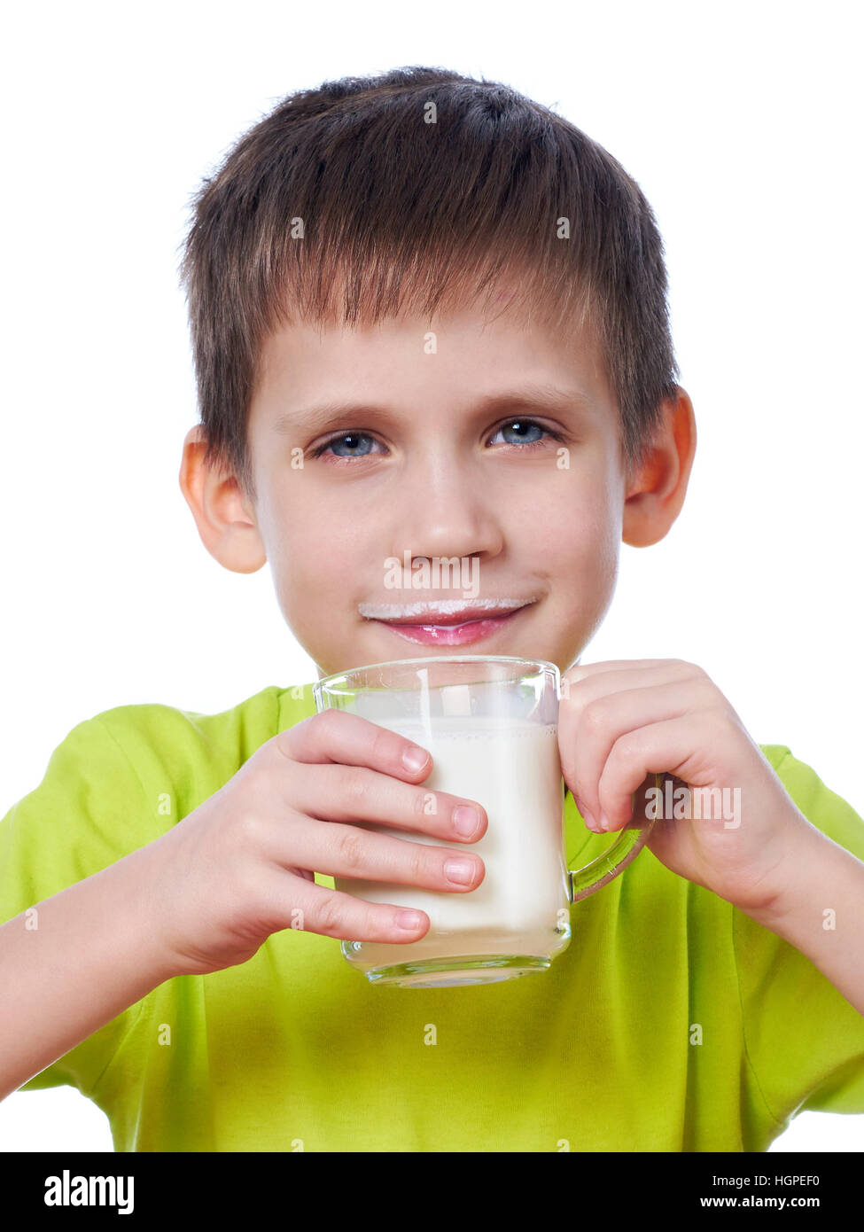 Beautiful little boy drinking milk isolated white Stock Photo - Alamy