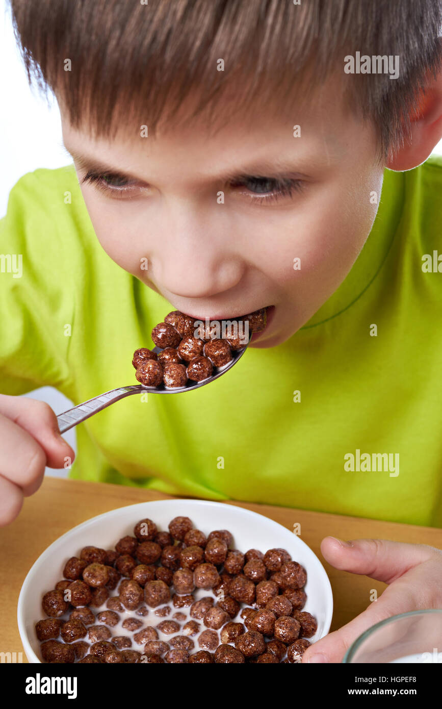 Little boy eating breakfast closeup Stock Photo - Alamy