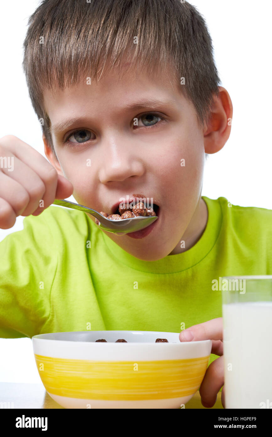 Little boy eating breakfast closeup Stock Photo - Alamy