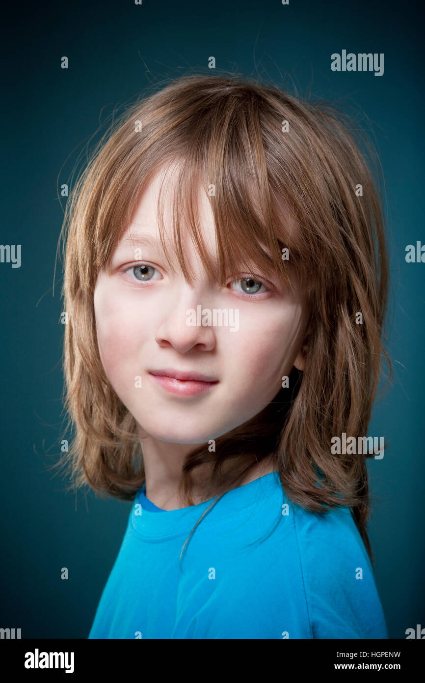 Portrait of a Boy with Blond Hair in Blue Top Stock Photo - Alamy
