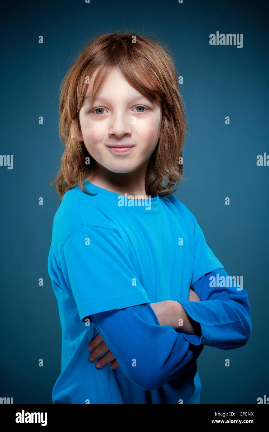 Portrait of a Boy with Blond Hair in Blue Top Stock Photo - Alamy