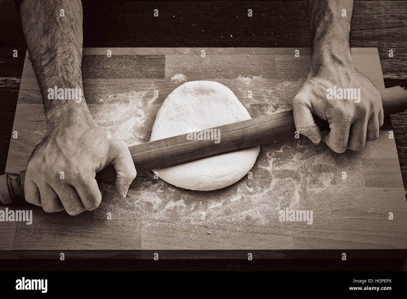 Making handmade pasta with wooden rolling pin Stock Photo - Alamy