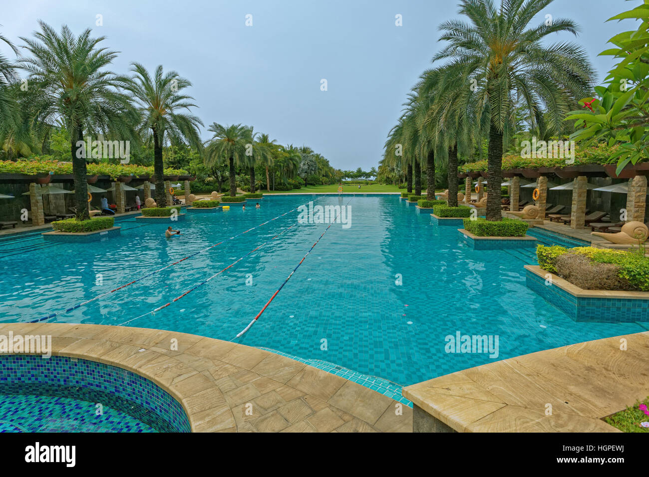 Hotel pool with decorations, steps and trees Stock Photo - Alamy