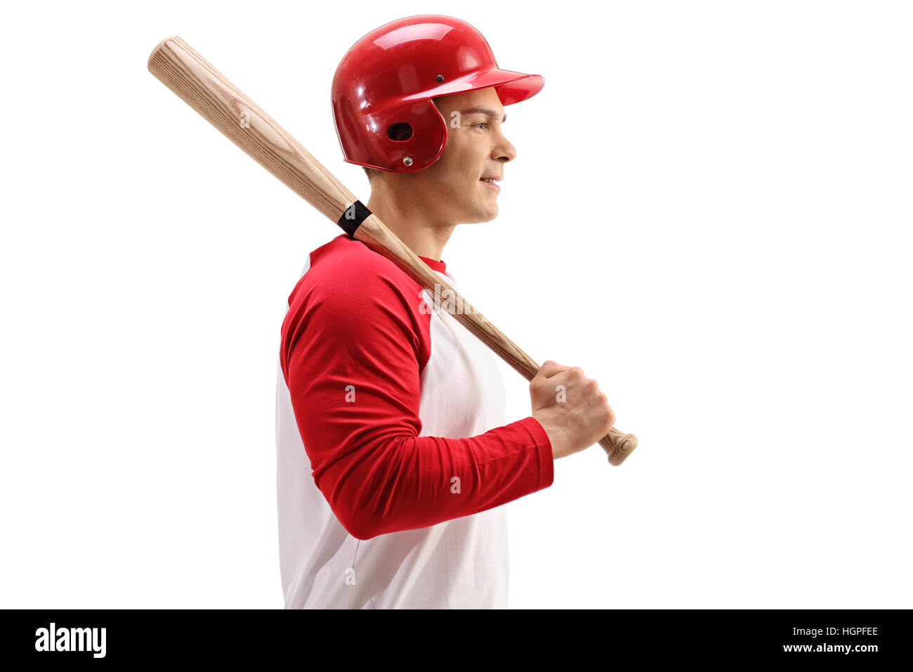 Profile shot of a baseball player with a helmet and a bat isolated on ...