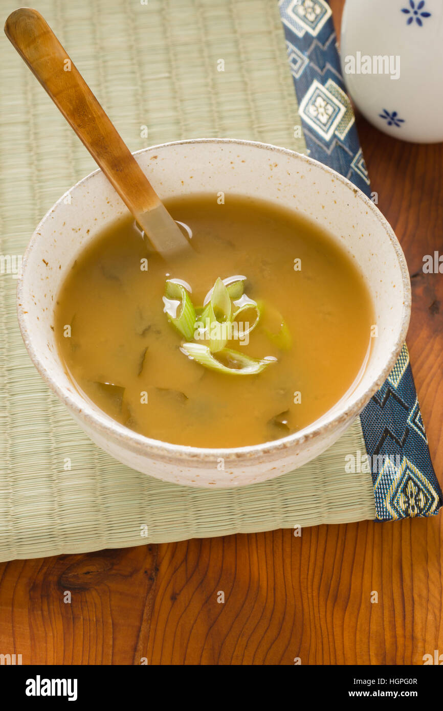 Japanese yellow awase or mixed miso soup with chopped spring onion or ...