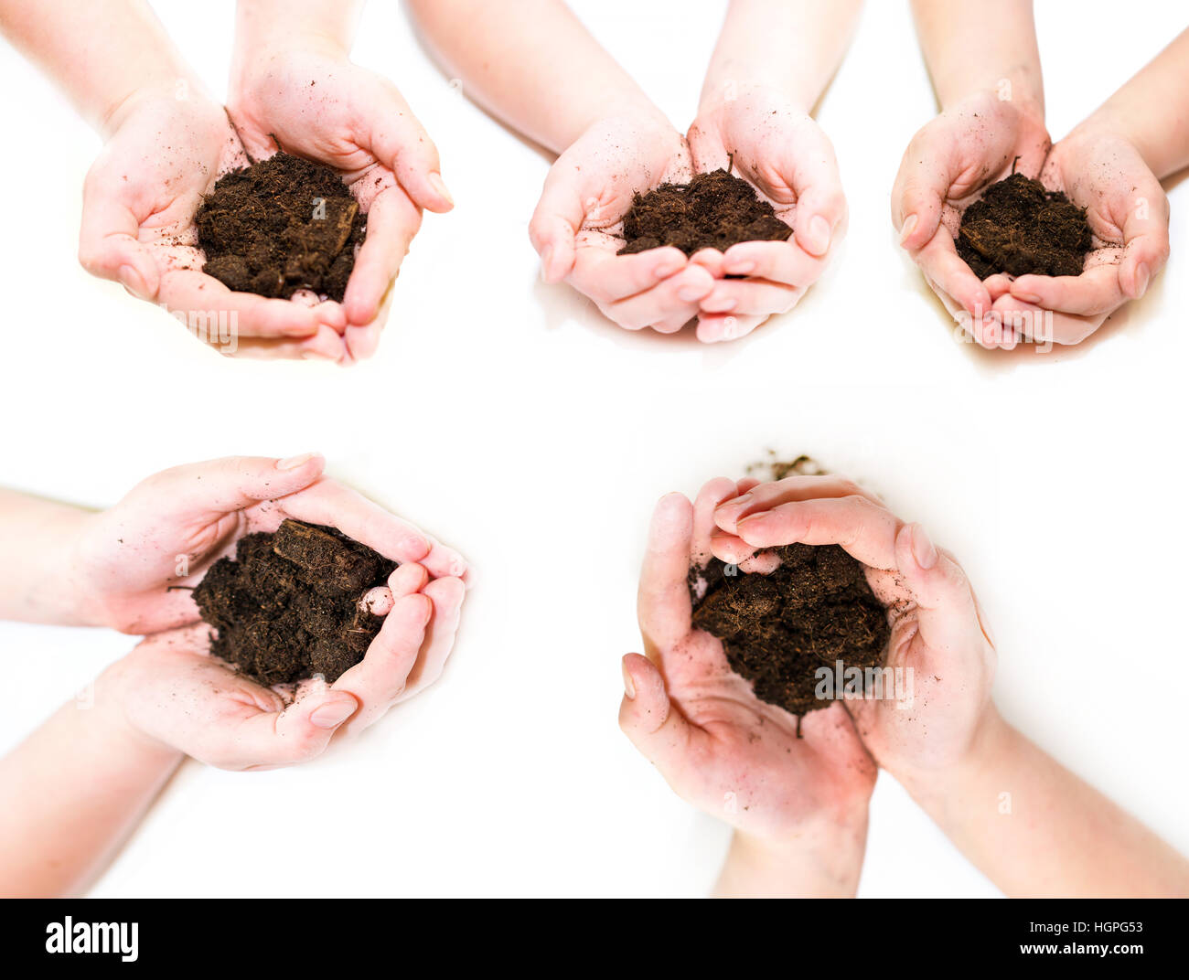 Handful of rich fertile soil in human hands isolated on white ...