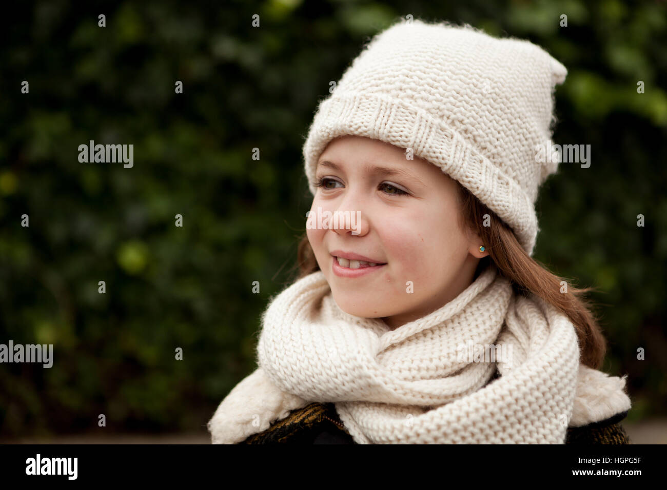 Pretty girl with wool hat in a park at winter Stock Photo - Alamy