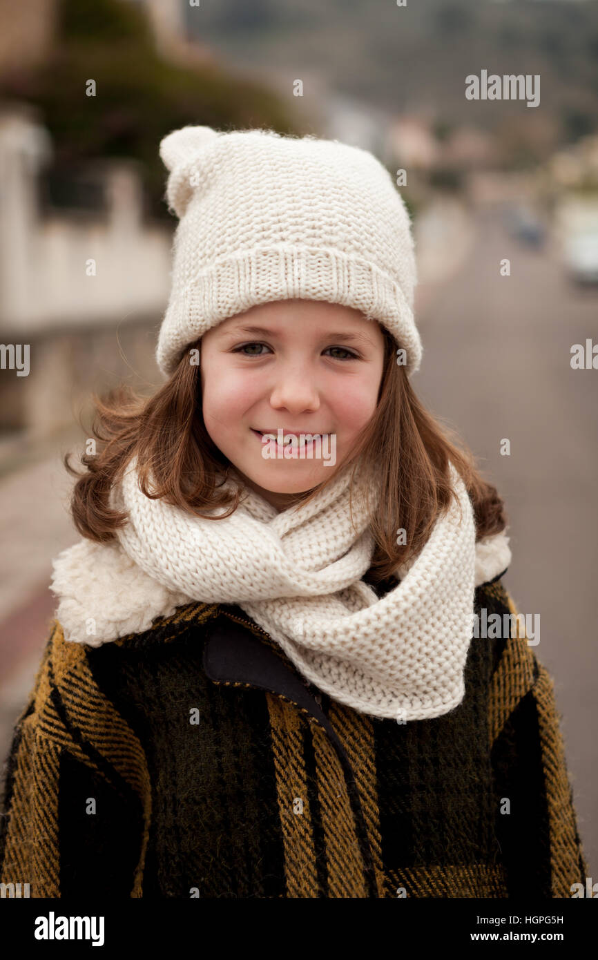 Pretty girl with wool hat in a park at winter Stock Photo - Alamy