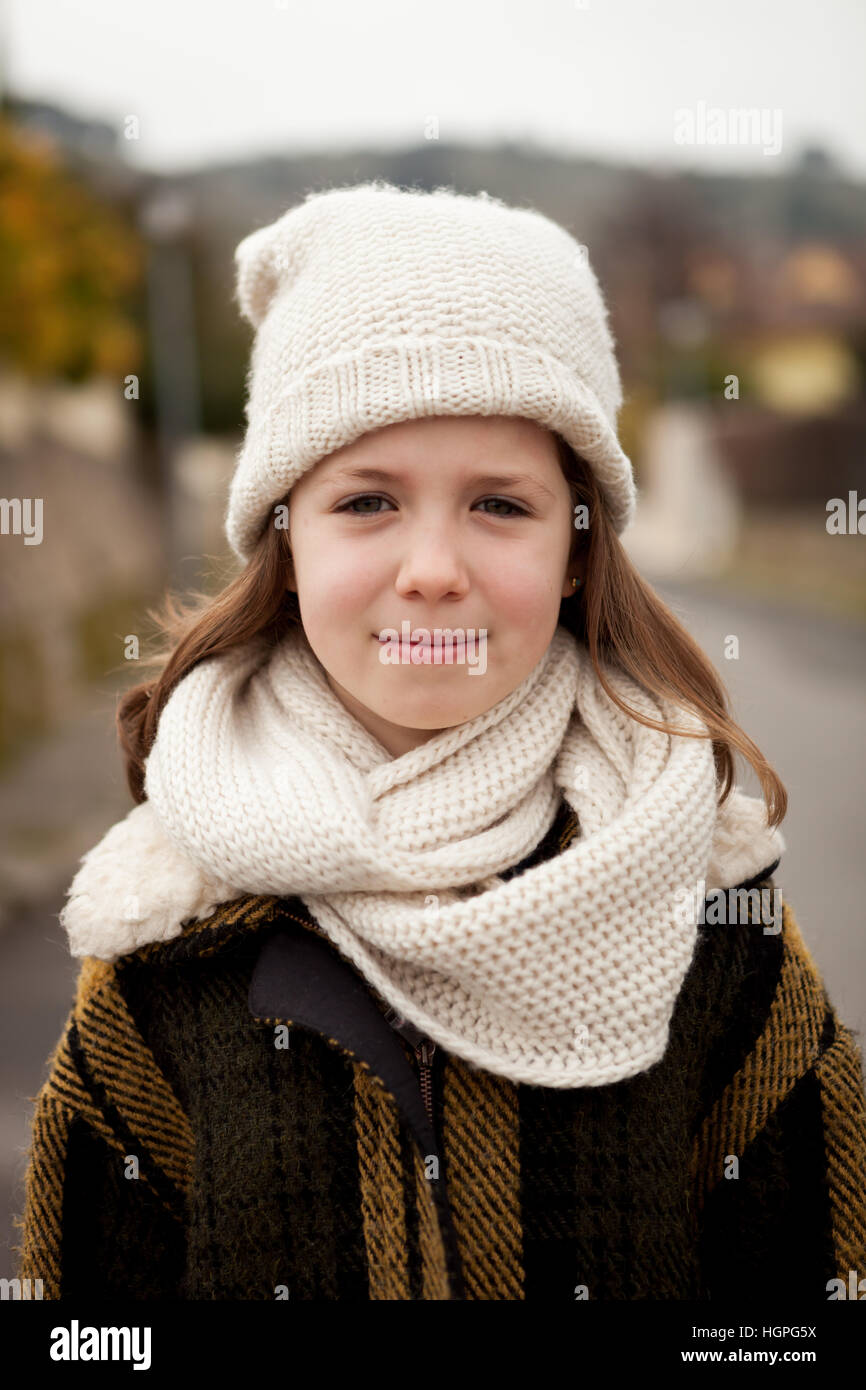 Pretty girl with wool hat in a park at winter Stock Photo - Alamy