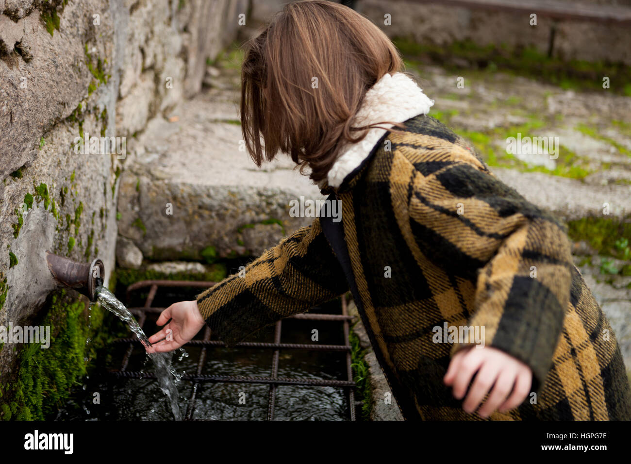 Child touching water hi-res stock photography and images - Alamy