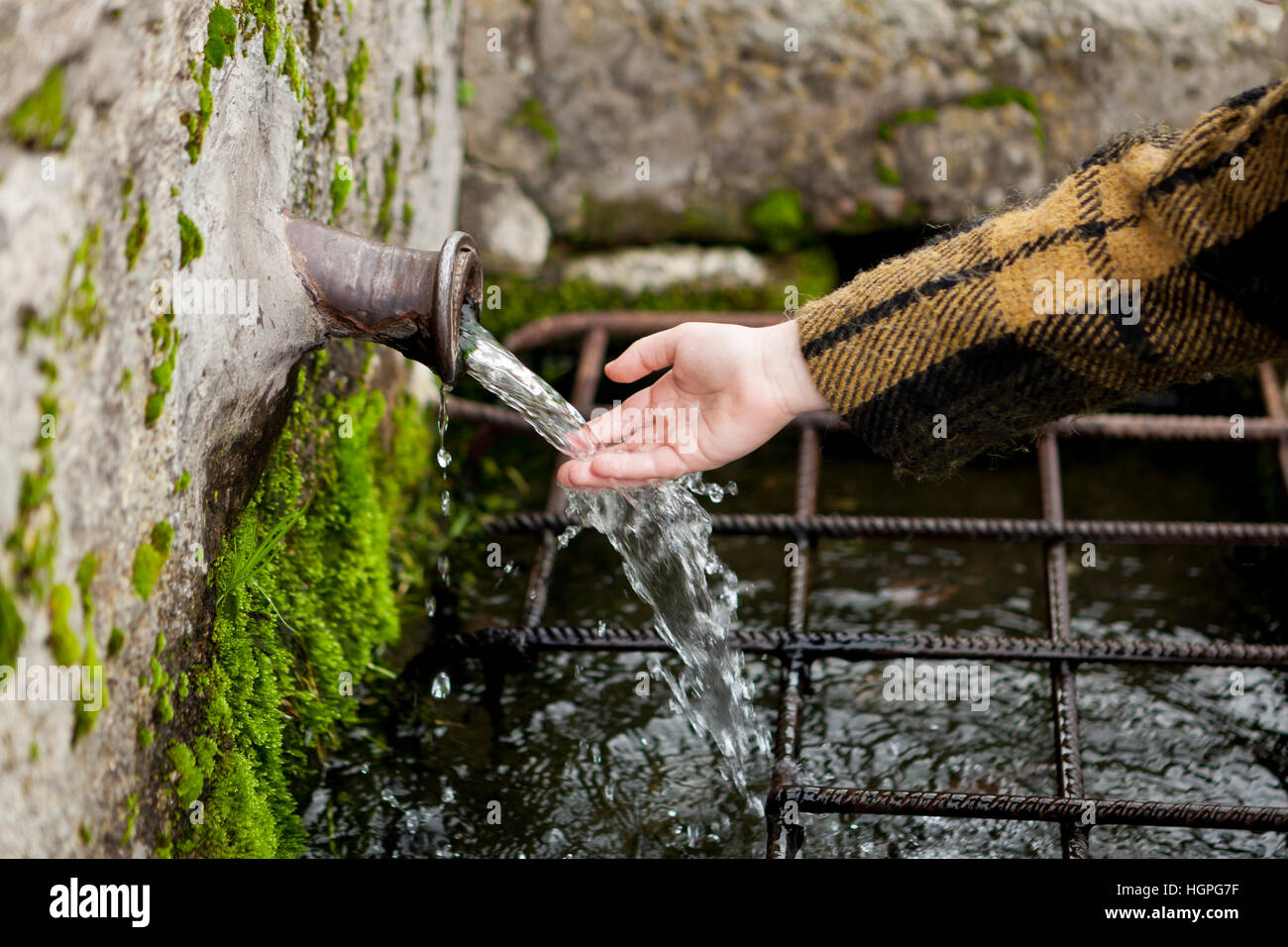 Child touching water hi-res stock photography and images - Alamy