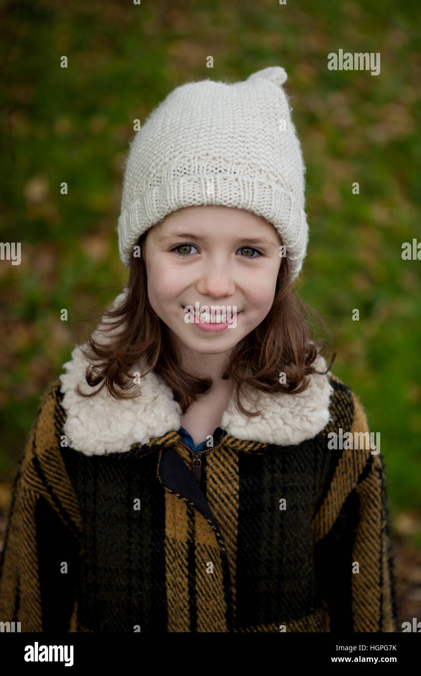 Pretty girl with wool hat in a park at winter Stock Photo - Alamy