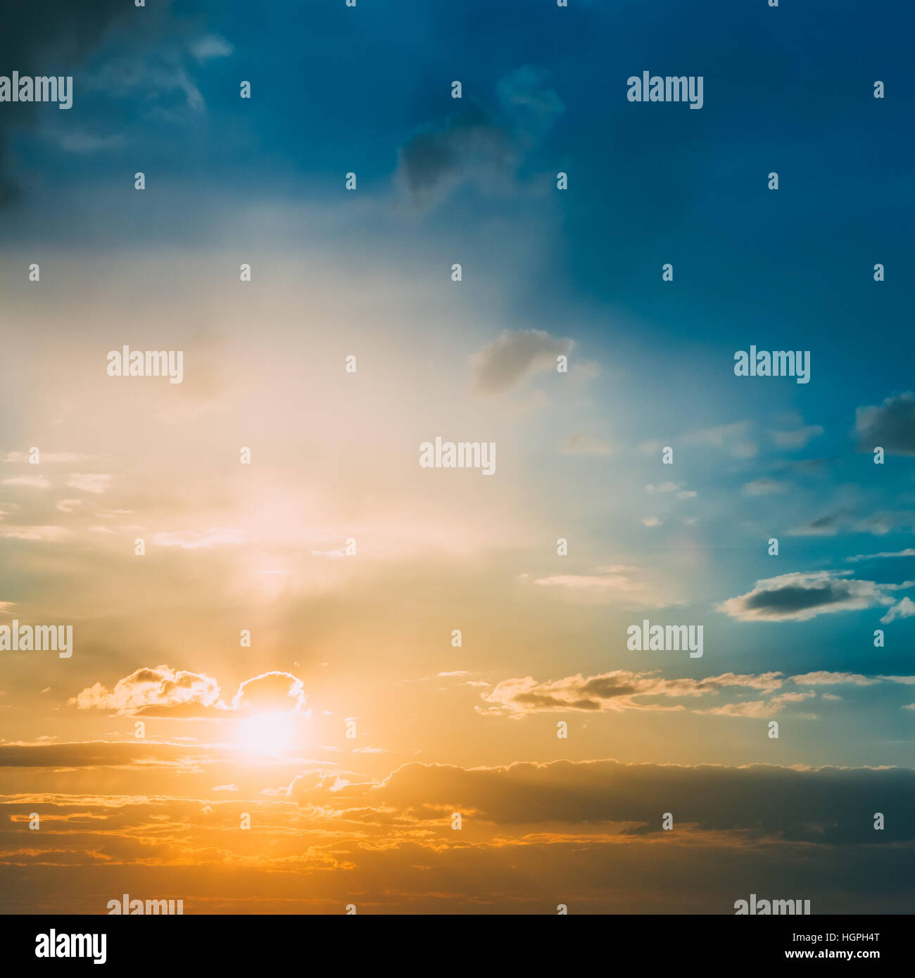 Bright Sun, Sunset, Sunrise. Colorful Blue and Yellow Sky Stock Photo ...