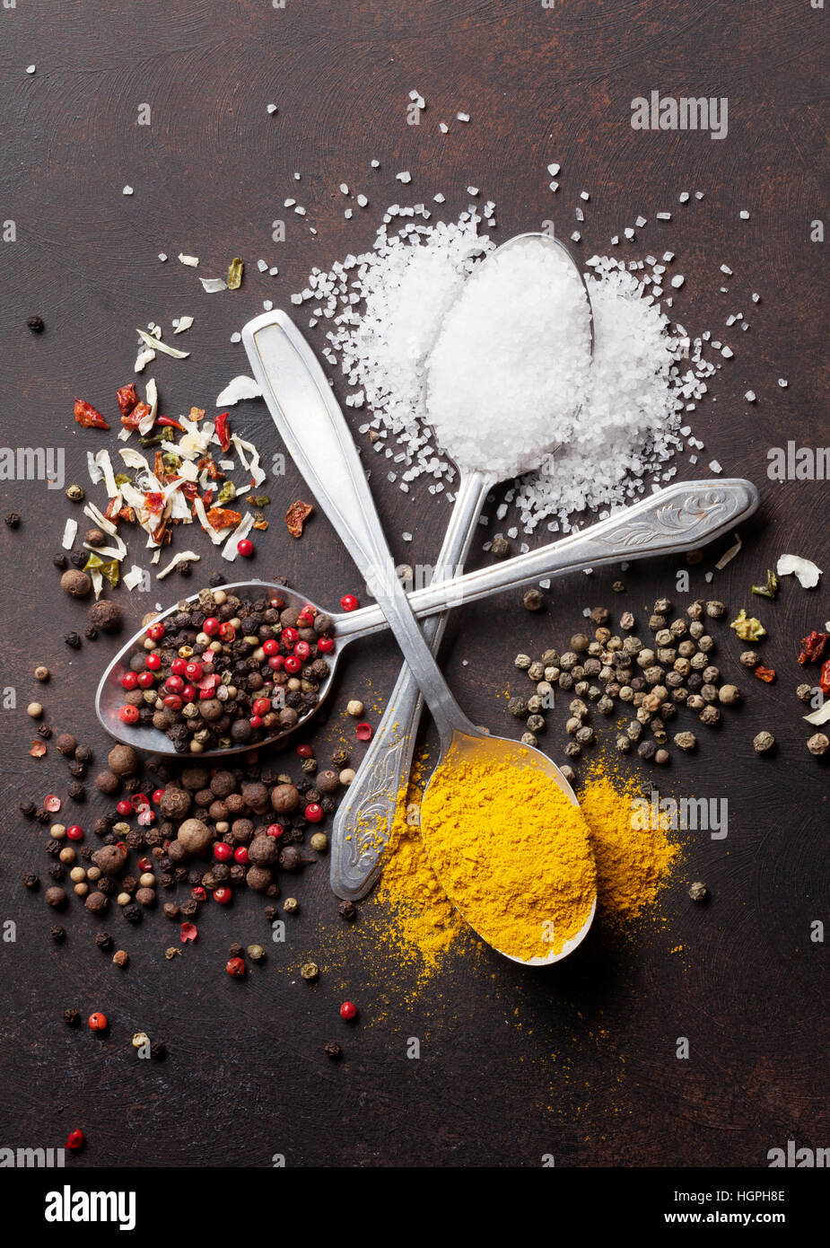 Various spices spoons on stone table. Top view Stock Photo - Alamy