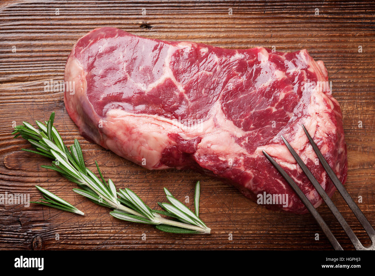 Raw ribeye beef steak cooking with ingredients. Top view Stock Photo ...