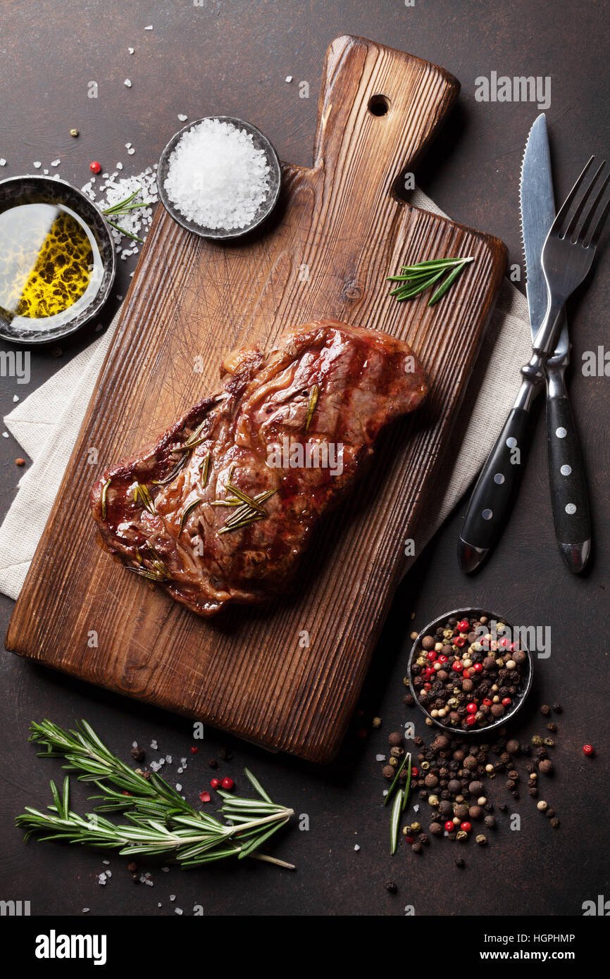 Grilled ribeye beef steak, herbs and spices. Top view Stock Photo - Alamy