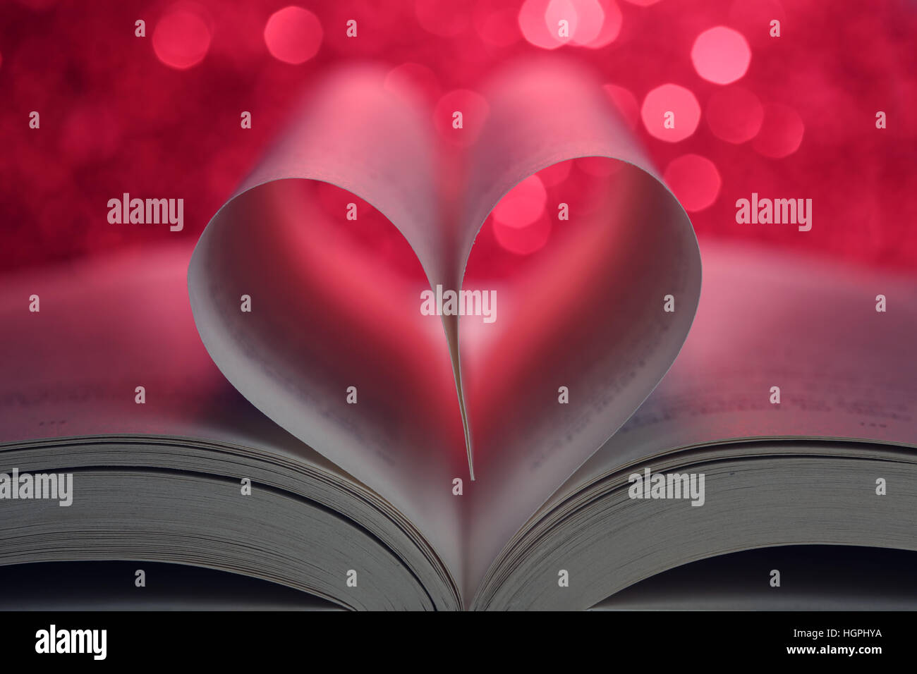 Book pages in the shape of a heart Stock Photo - Alamy