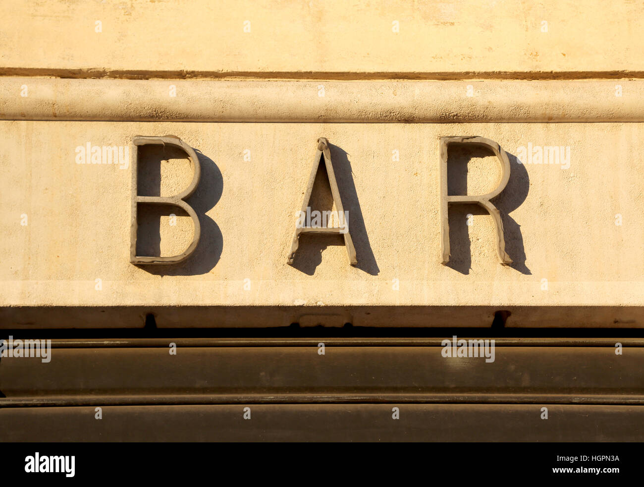 Big sign of BAR in large letters on the wall of the building Stock ...