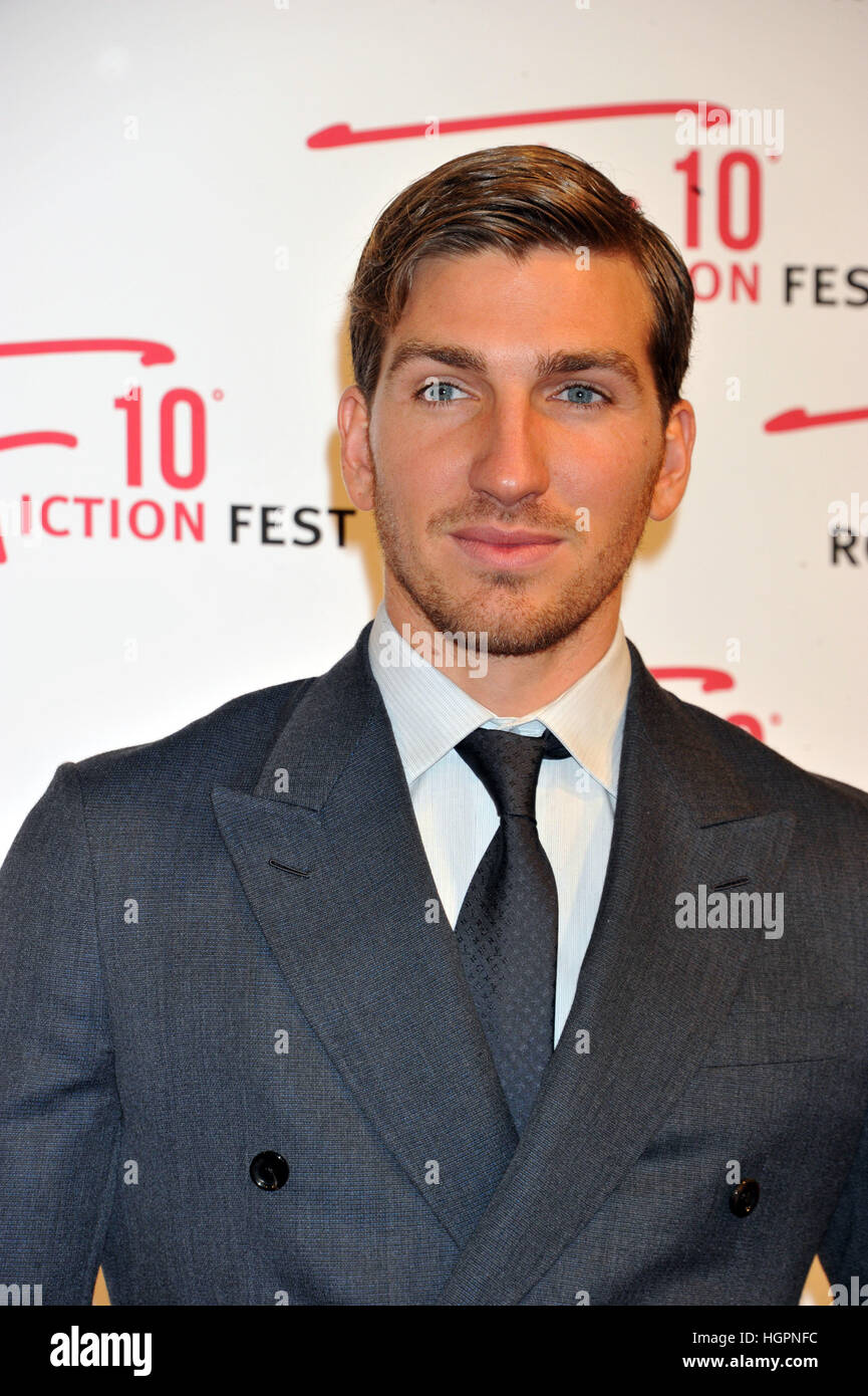 Alan Cappelli (wearing a Luis Vuitton suit) attending the premiere of ...