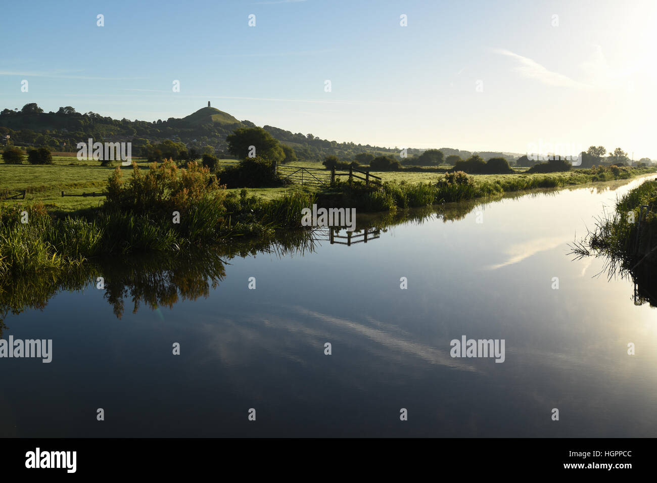 Glastonbury tor and river brue at dawn on a summer morning, somerset ...