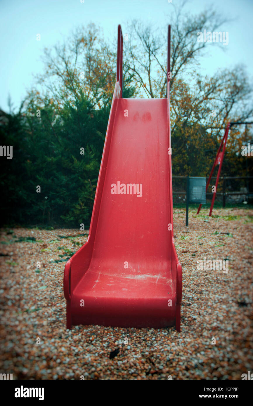 Red slide in a park Stock Photo - Alamy