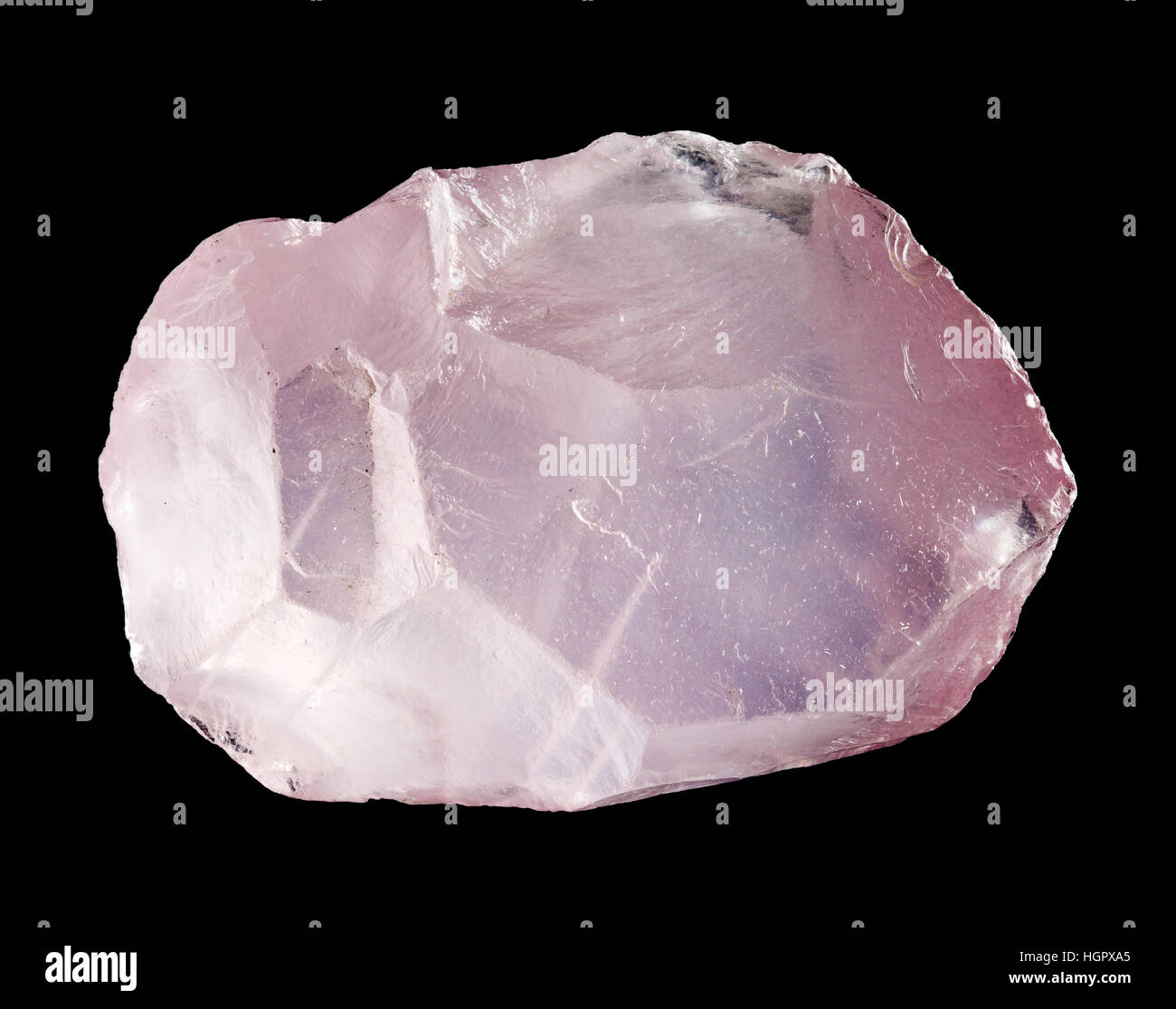 Raw, uncut rose quartz crystal isolated on black background Stock Photo ...