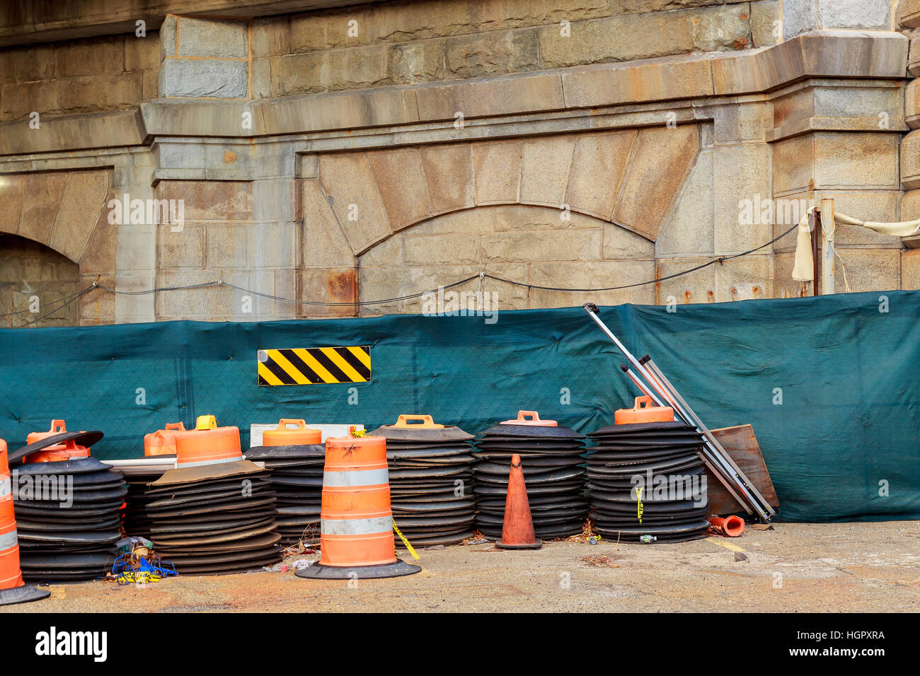 Construction zone with orange caution markers along an urban street ...