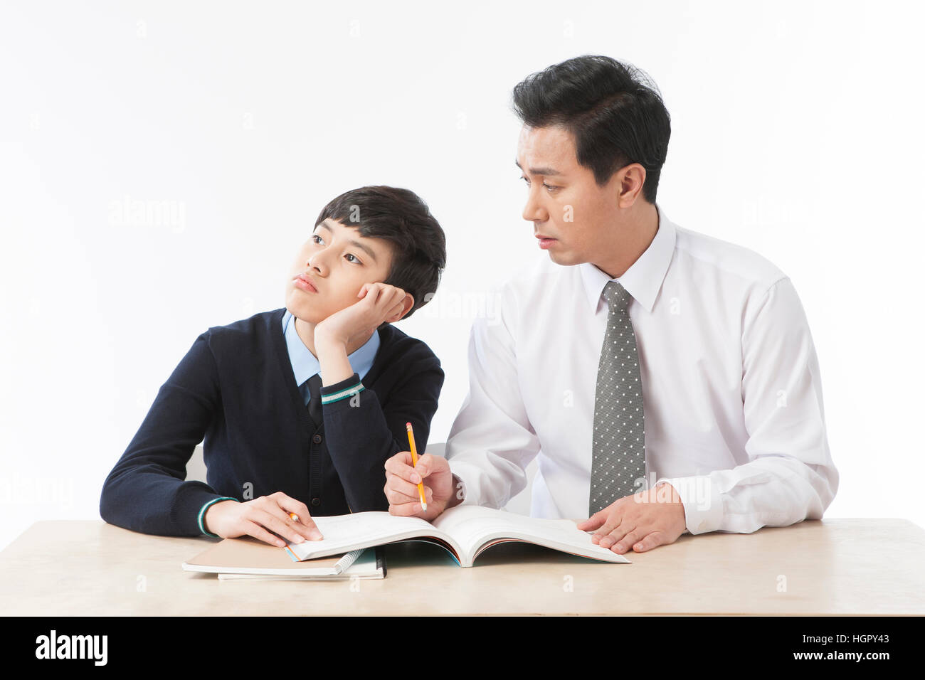 Portrait of teacher worried and school boy bored Stock Photo - Alamy