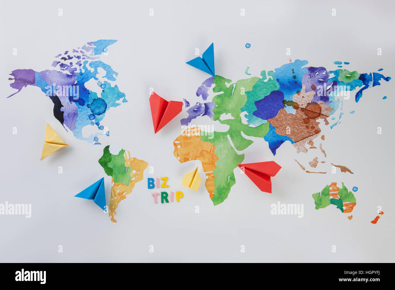 Paper airplanes on world map representing global business trip Stock ...