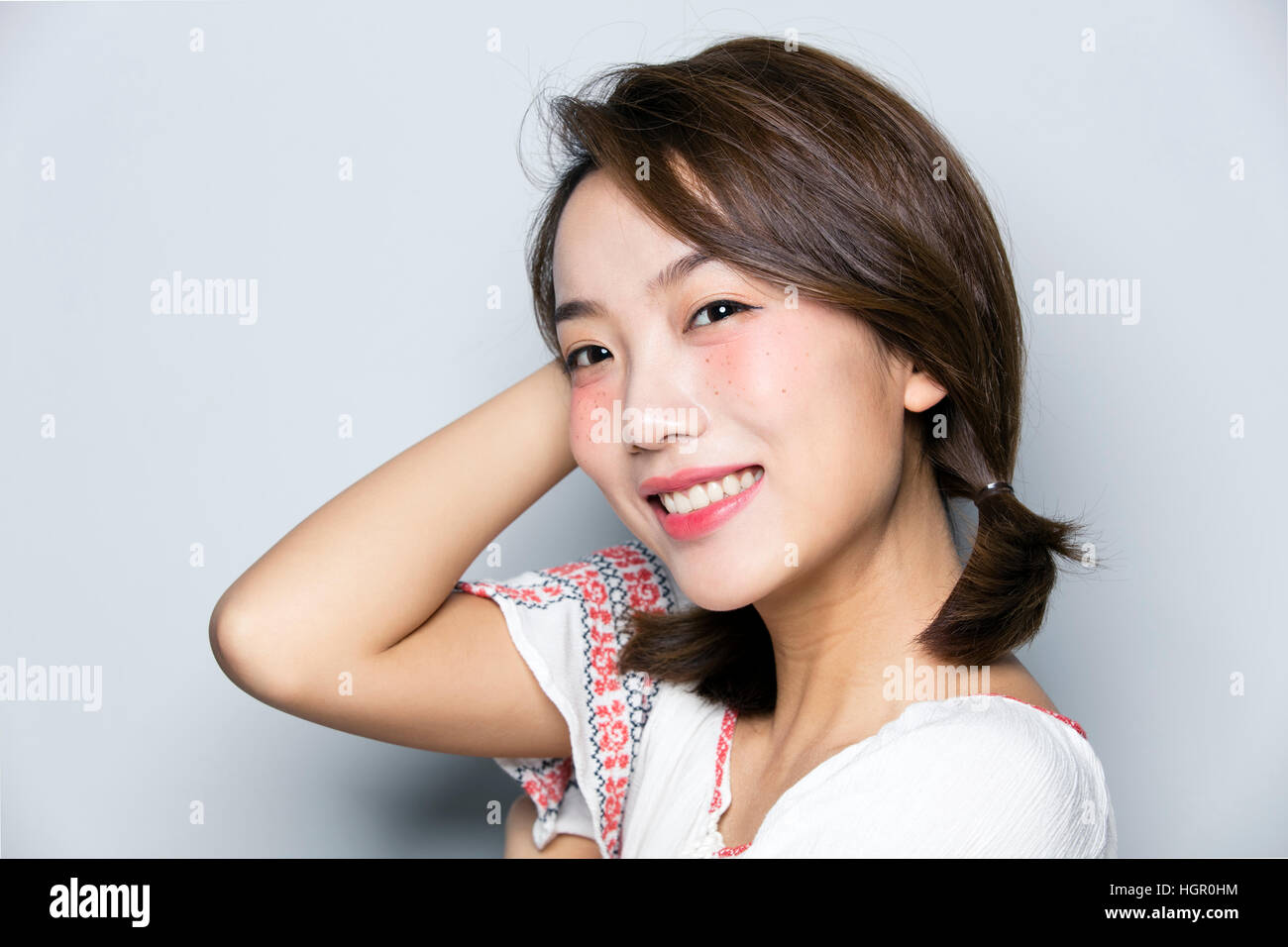 Side view portrait of young woman with bobbed hair and freckles Stock ...