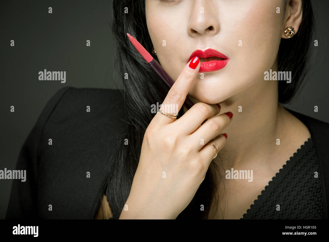 Portrait of young woman with red lips and red fingernails Stock Photo ...
