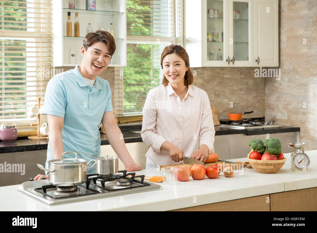 Asian couple cooking together hi-res stock photography and images - Alamy
