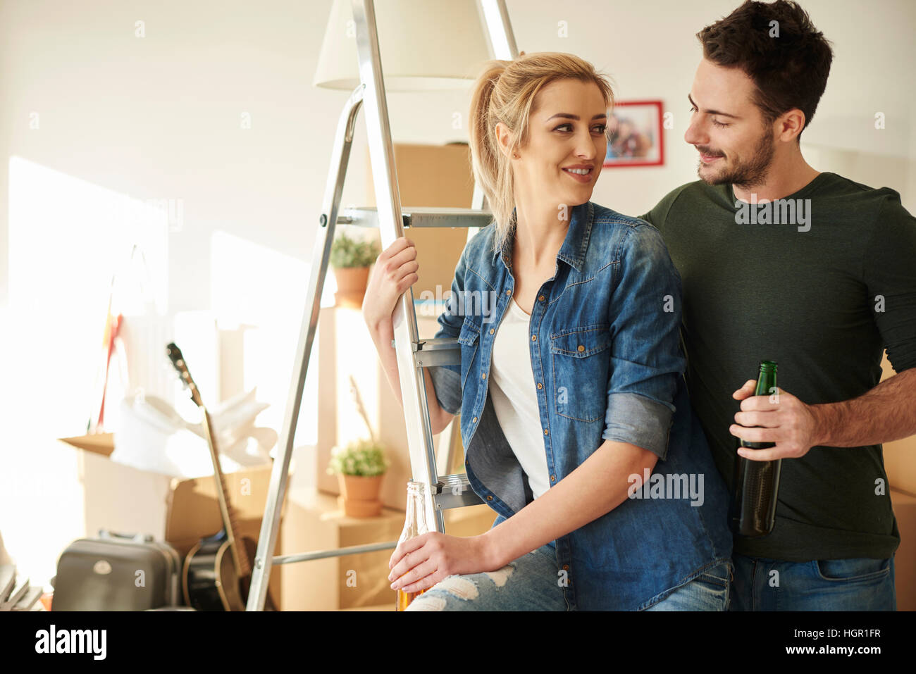 Couple making big plans at new home Stock Photo - Alamy