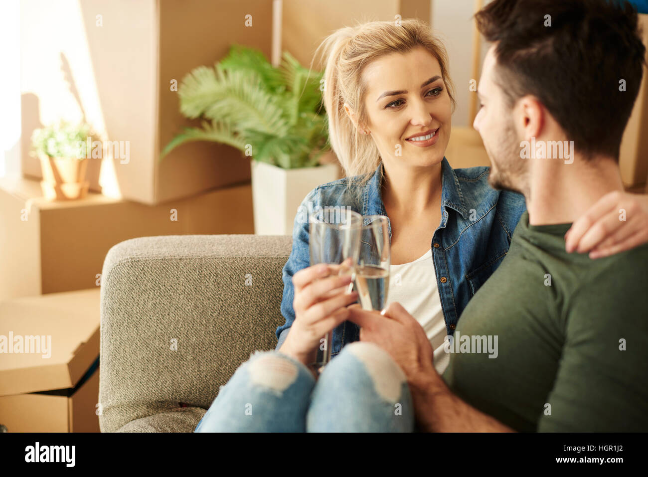 Couple chilling on sofa hi-res stock photography and images - Alamy