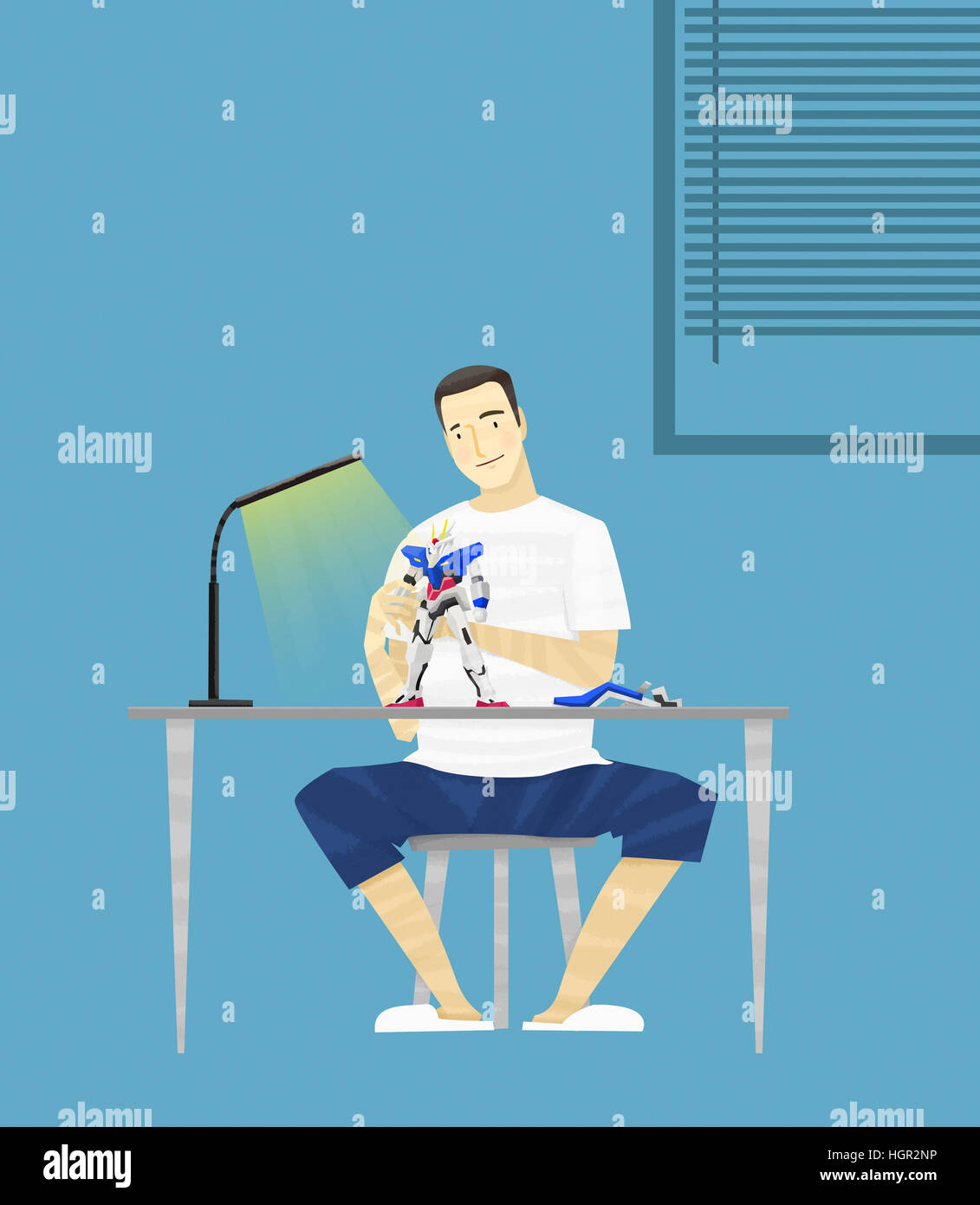 Kidult man playing with robot Stock Photo - Alamy