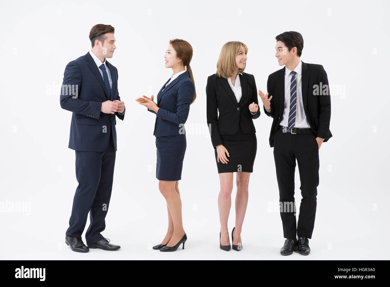 Four young people talking hi-res stock photography and images - Alamy