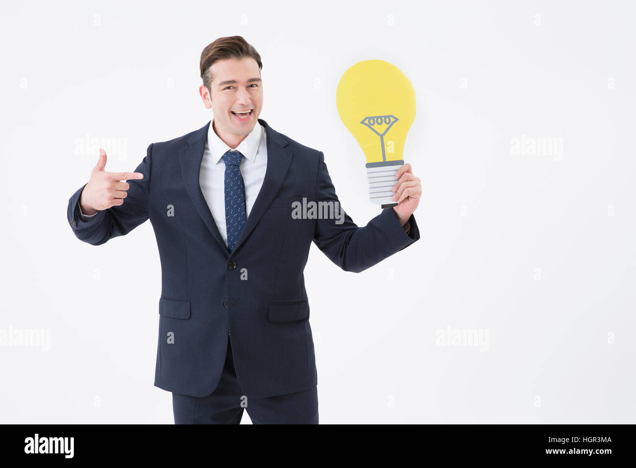 Man pointing at lightbulb hi-res stock photography and images - Alamy