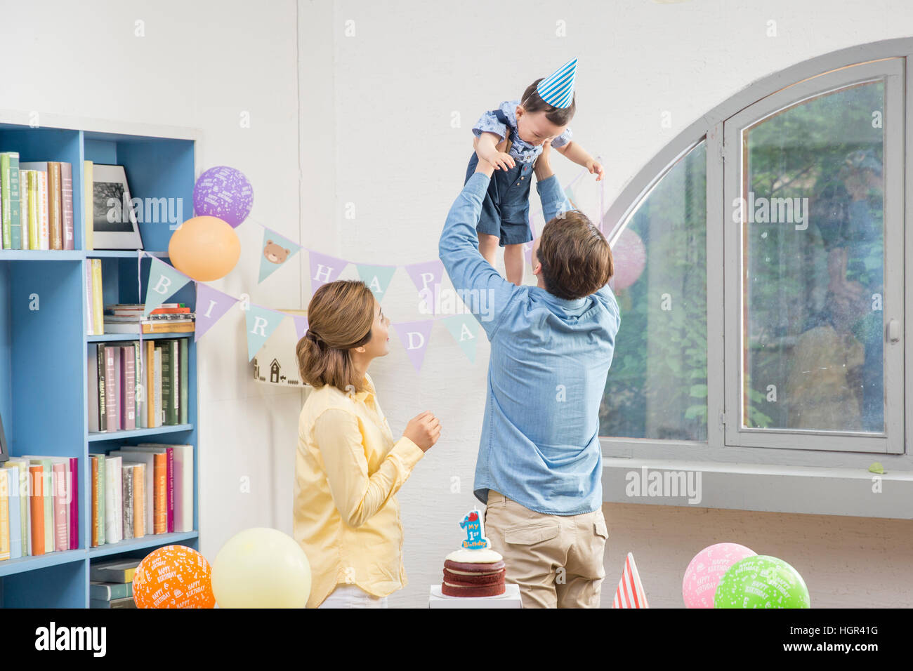 Young parents playing baby son hi-res stock photography and images - Alamy