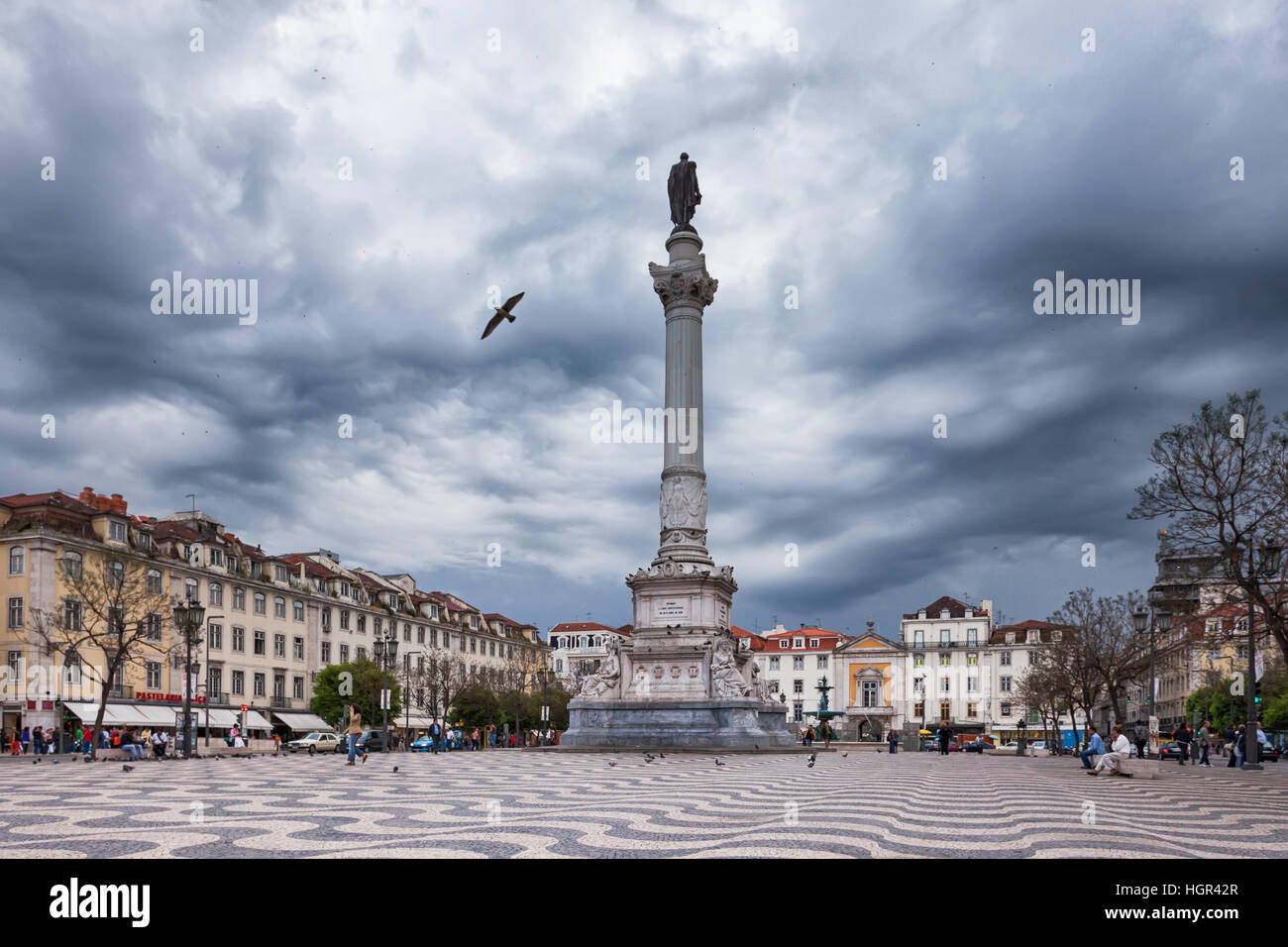 A seagull flying around a statue Stock Photo - Alamy
