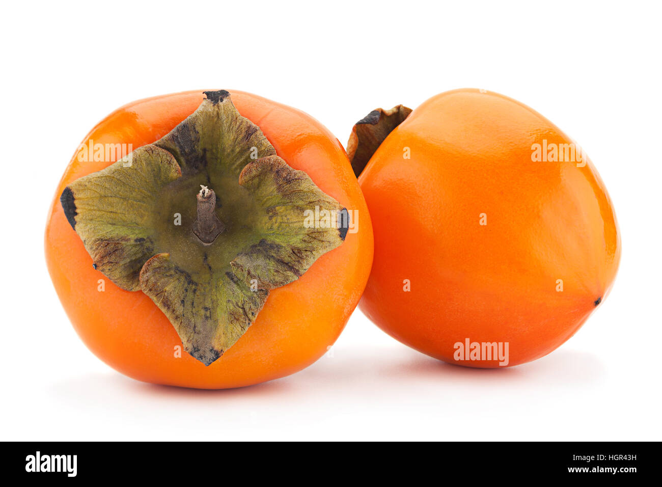 Persimmon fruit closeup isolated on white background Stock Photo - Alamy