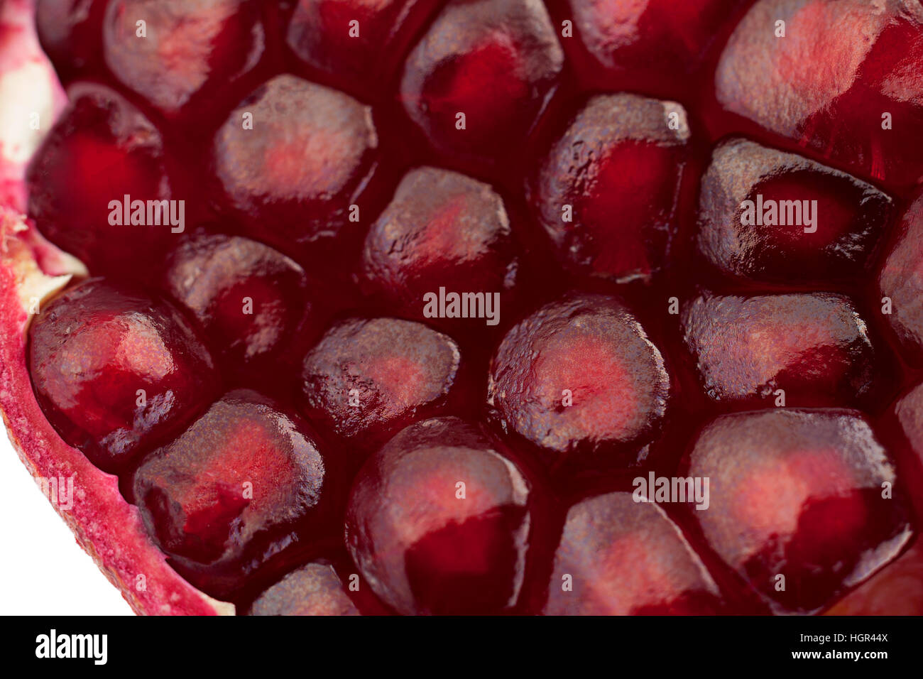 Pomegranate fruit closeup detail background Stock Photo - Alamy