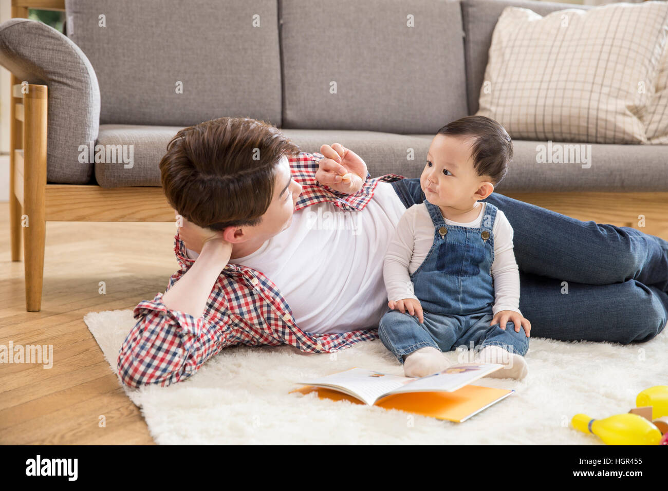 Father reading to baby hi-res stock photography and images - Alamy
