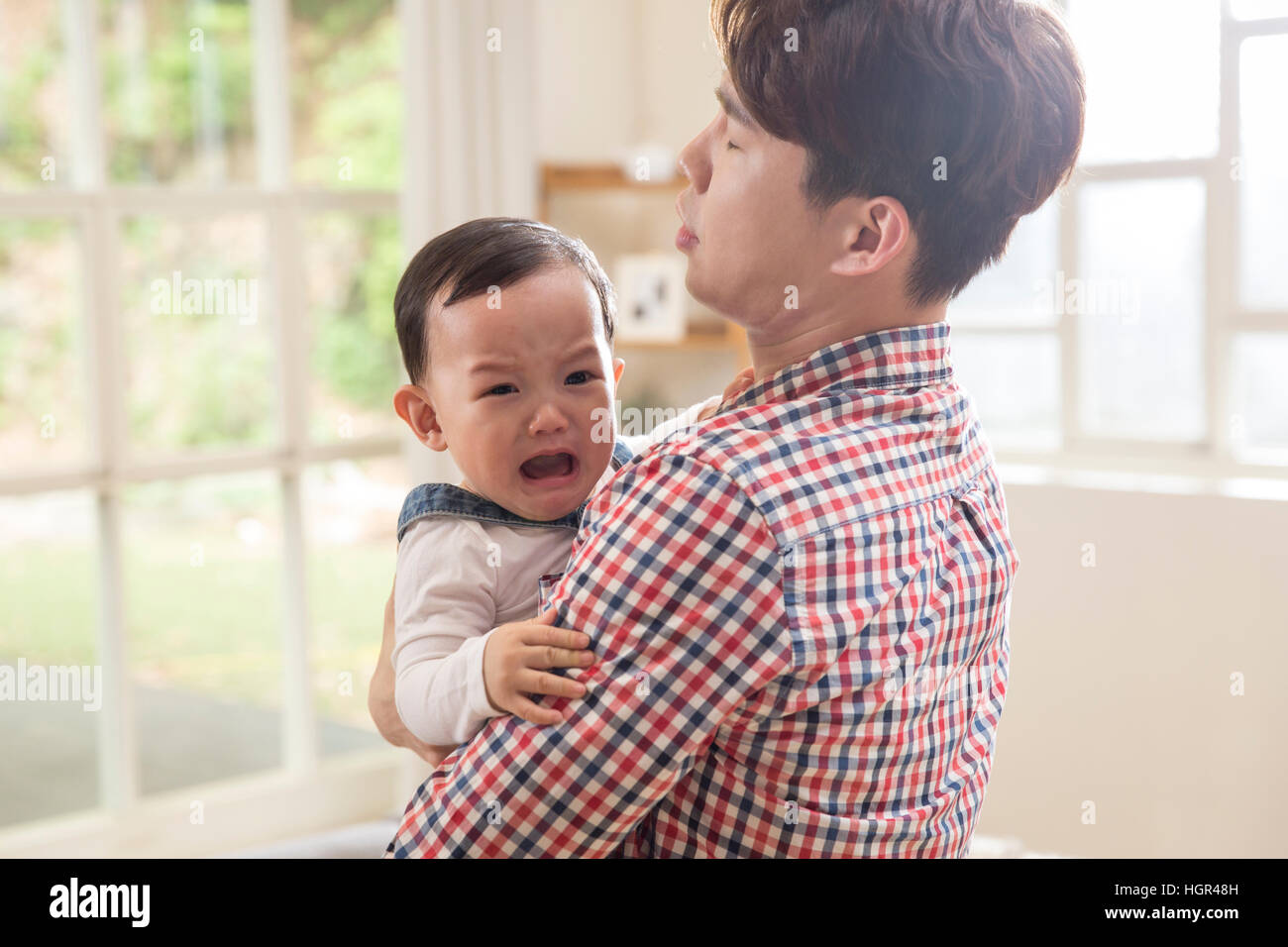 Father soothing his baby son Stock Photo - Alamy